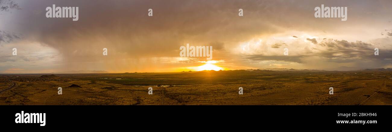 A panorama of a monsoon at sunset over the Sonoran desert of Arizona ...