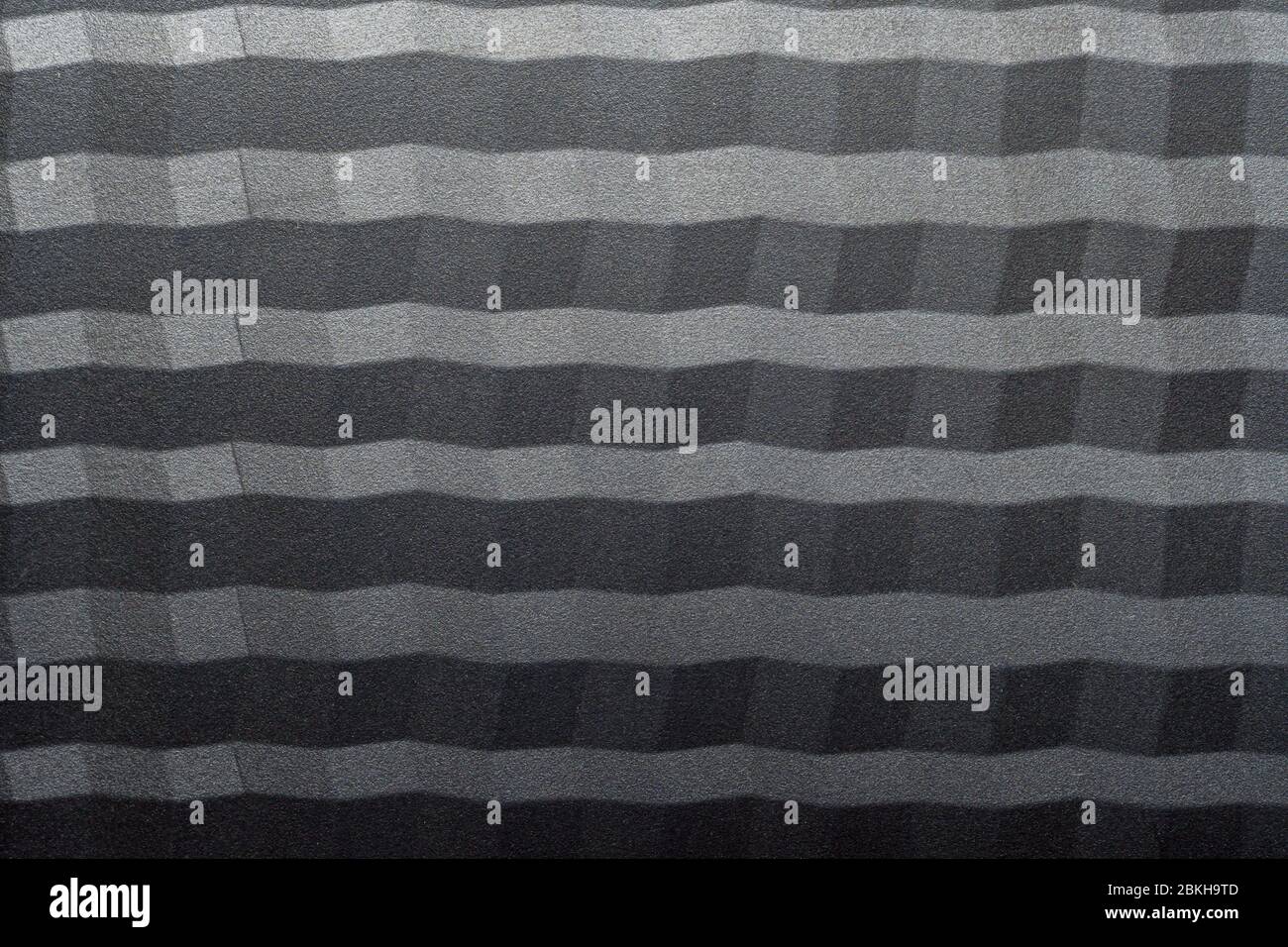 Geometric pattern background with a rough surface and contrasting light ...