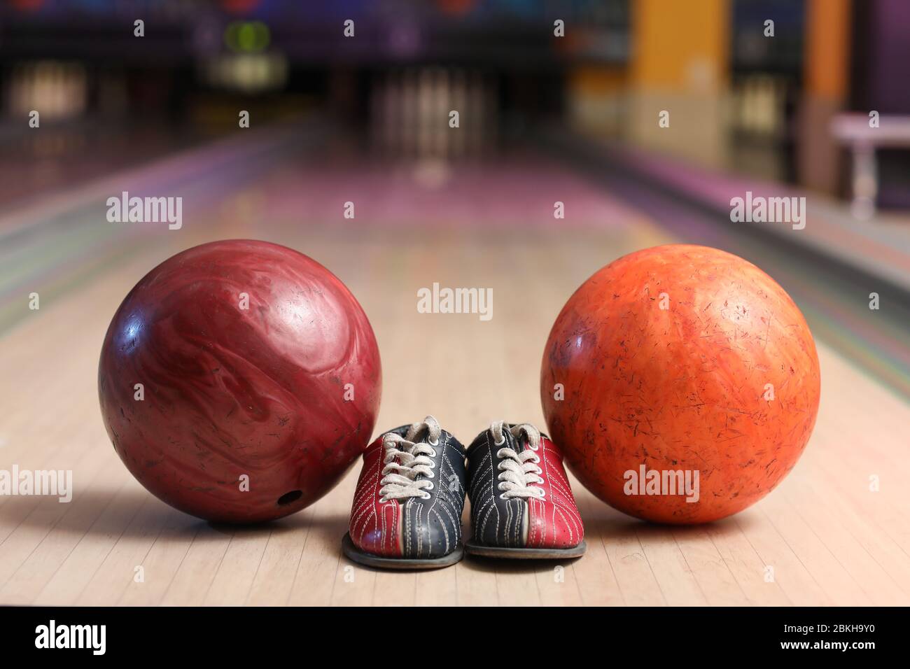 Balls and shoes on floor in bowling club Stock Photo - Alamy