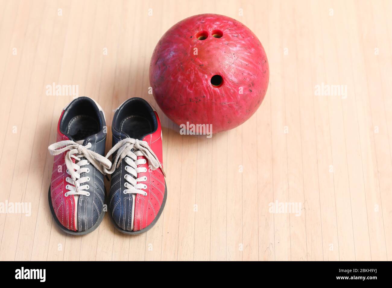 Ball and shoes on floor in bowling club Stock Photo - Alamy