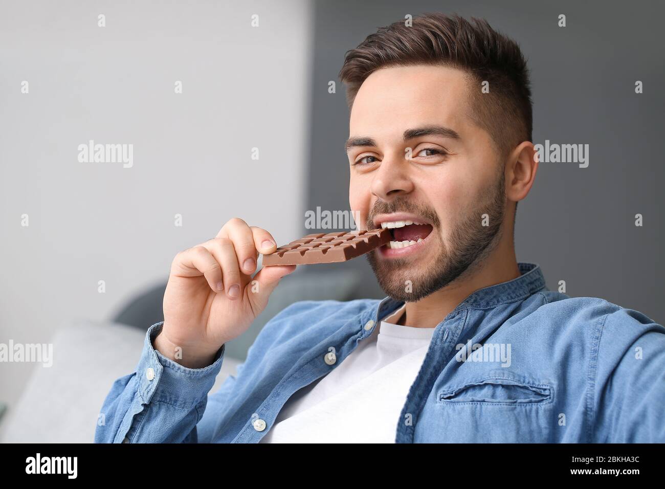 Man eating chocolate hi-res stock photography and images - Alamy