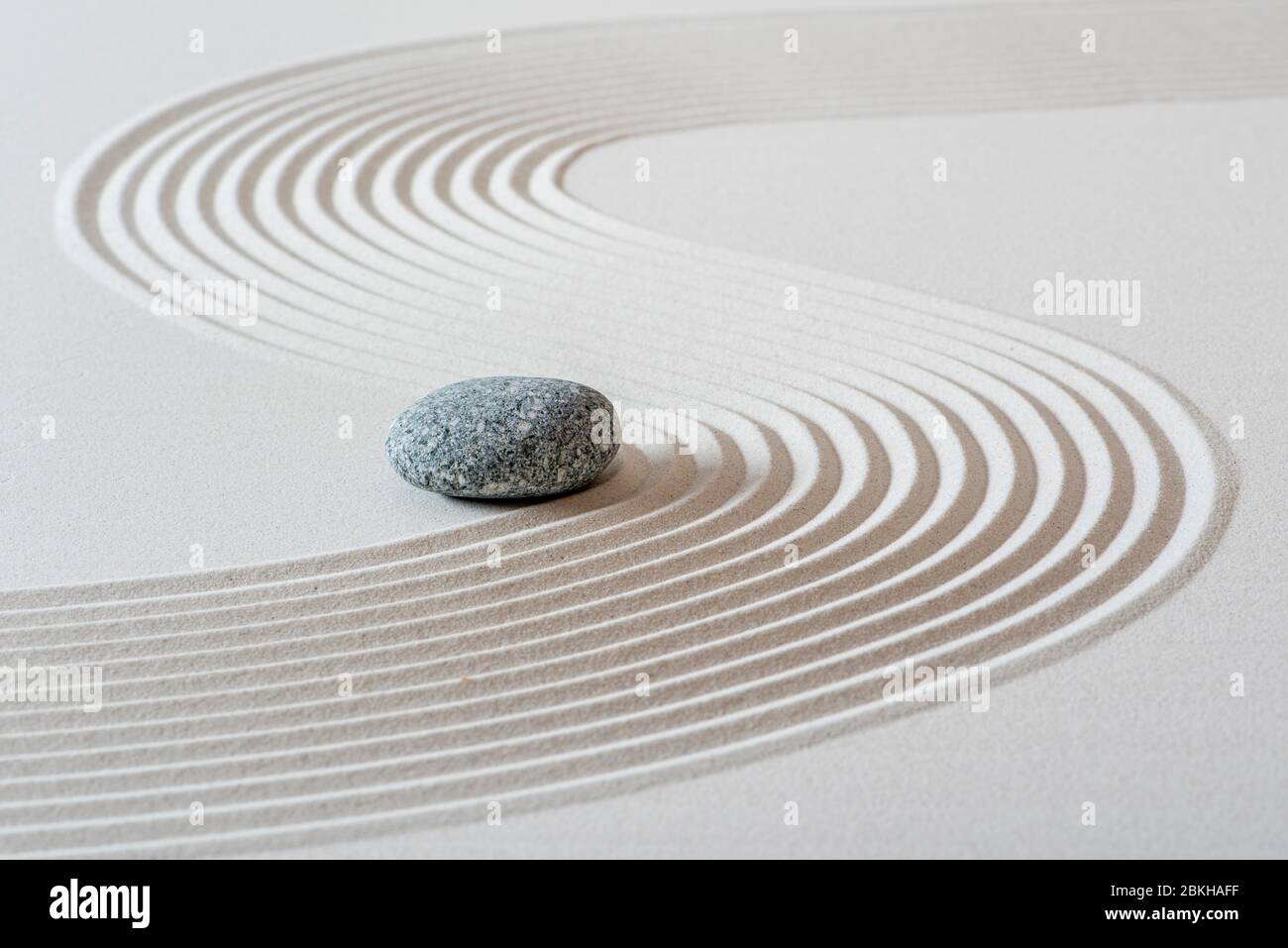 japanese garden with stone in textured sand Stock Photo - Alamy