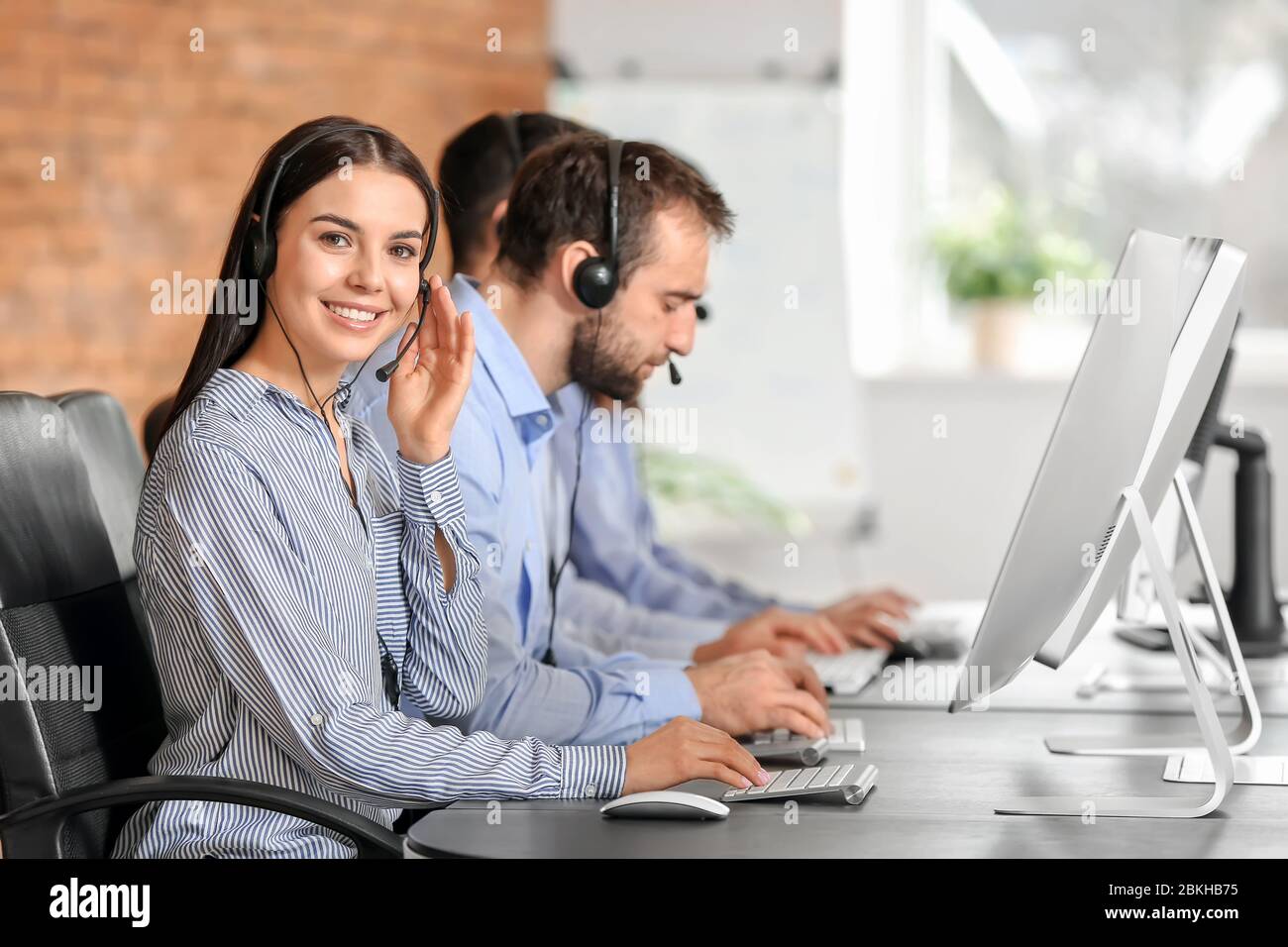 Team of technical support agents working in office Stock Photo - Alamy