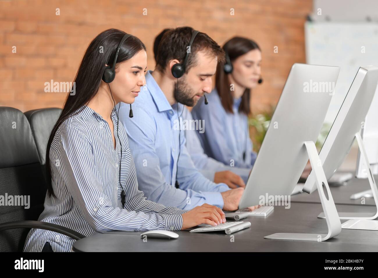 Team of technical support agents working in office Stock Photo - Alamy