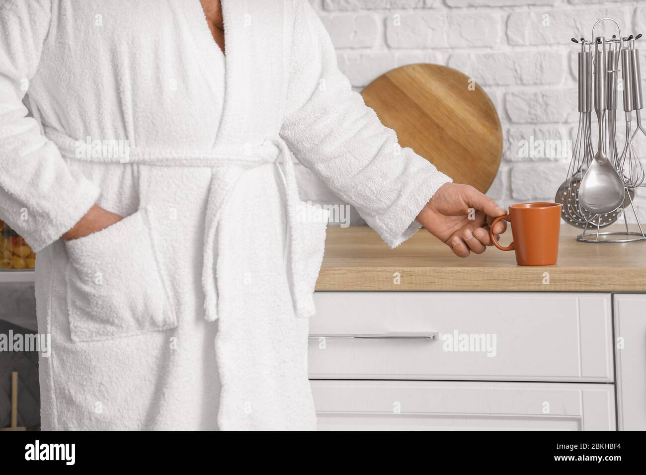Mature man drinking tea in kitchen Stock Photo - Alamy