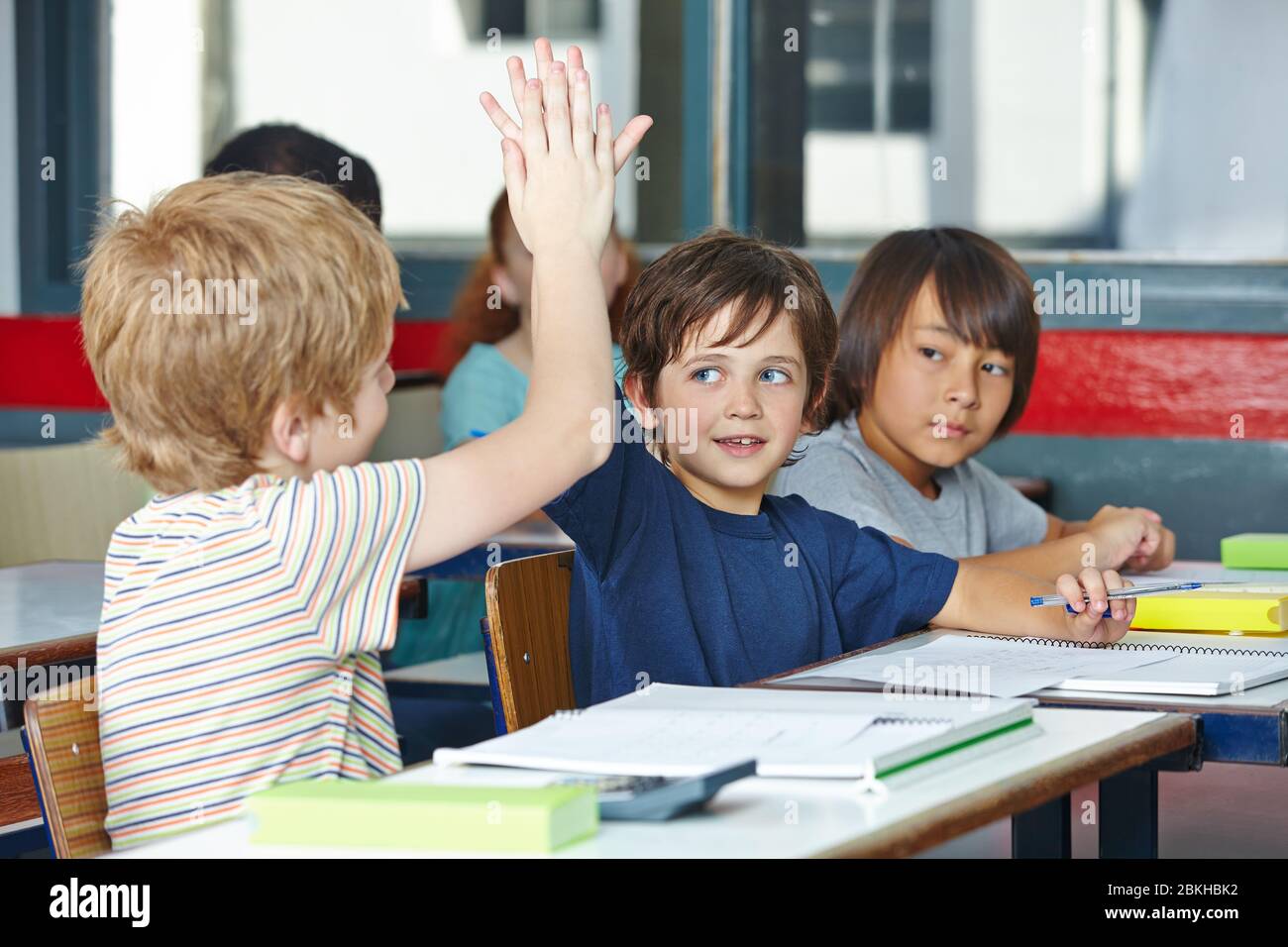 Two successful elementary school students clap their hands Stock Photo ...