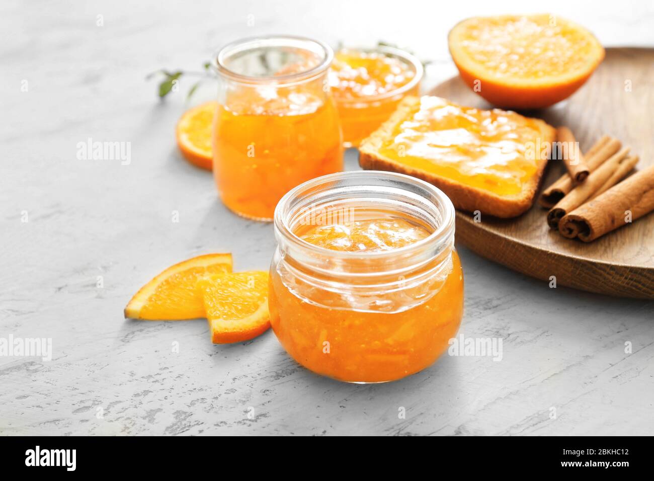 Jar of orange jam on white background Stock Photo - Alamy