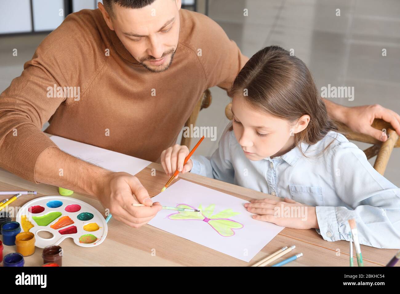 Drawing teacher giving optional classes at school Stock Photo - Alamy