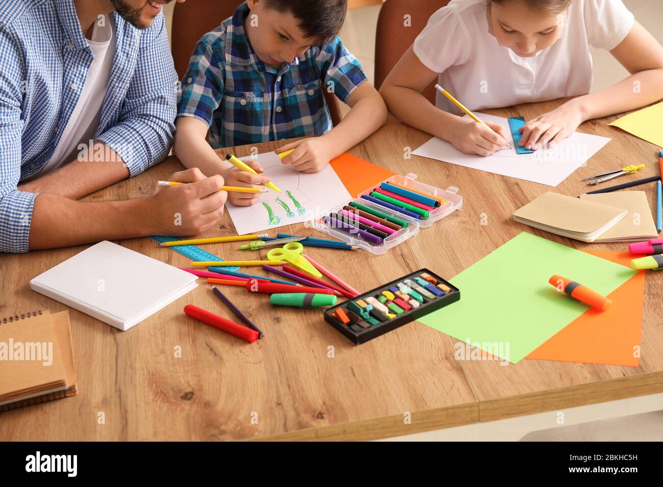 Drawing teacher giving optional classes at school Stock Photo - Alamy