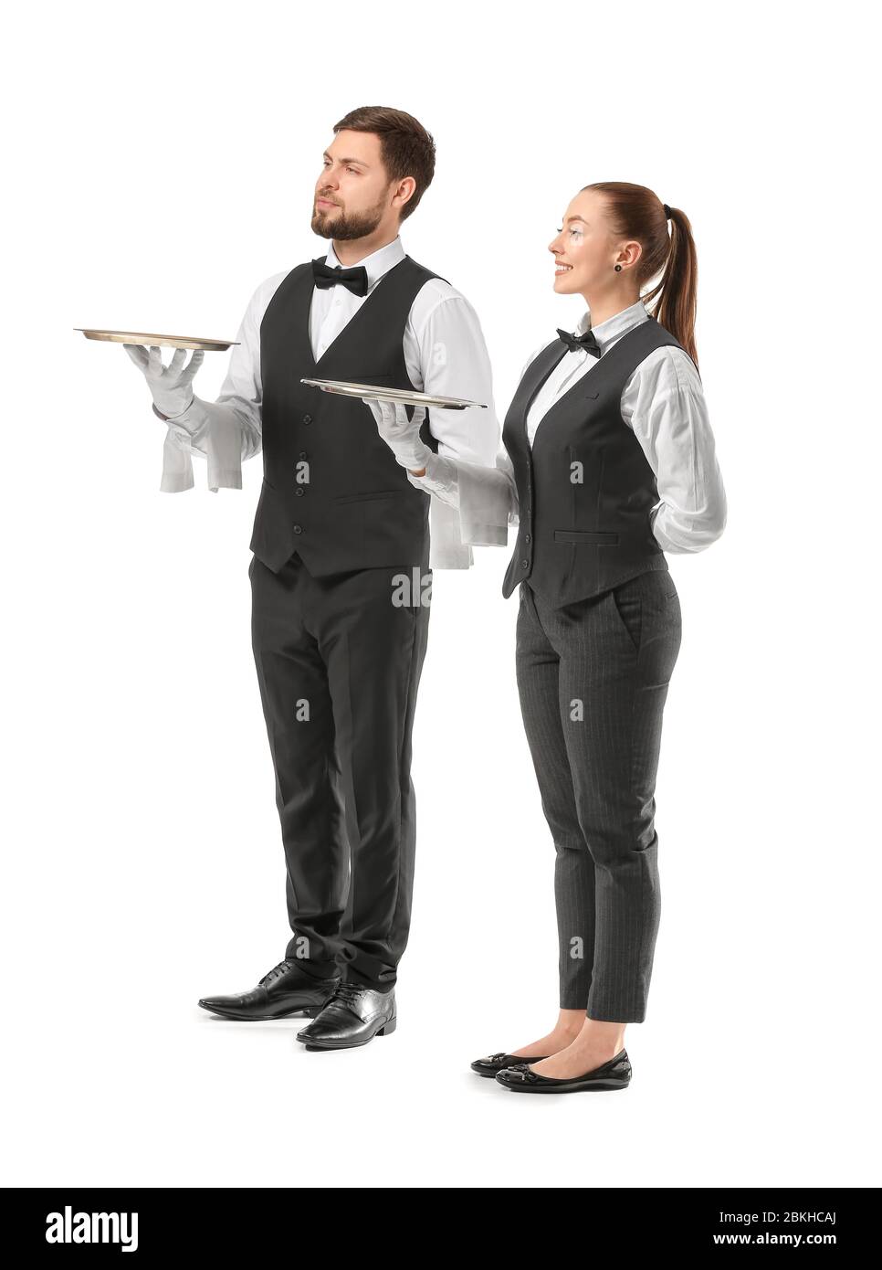 Male and female waiters on white background Stock Photo - Alamy