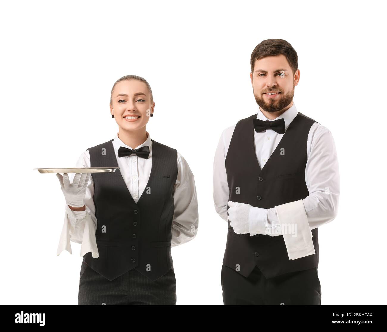 Male and female waiters on white background Stock Photo - Alamy