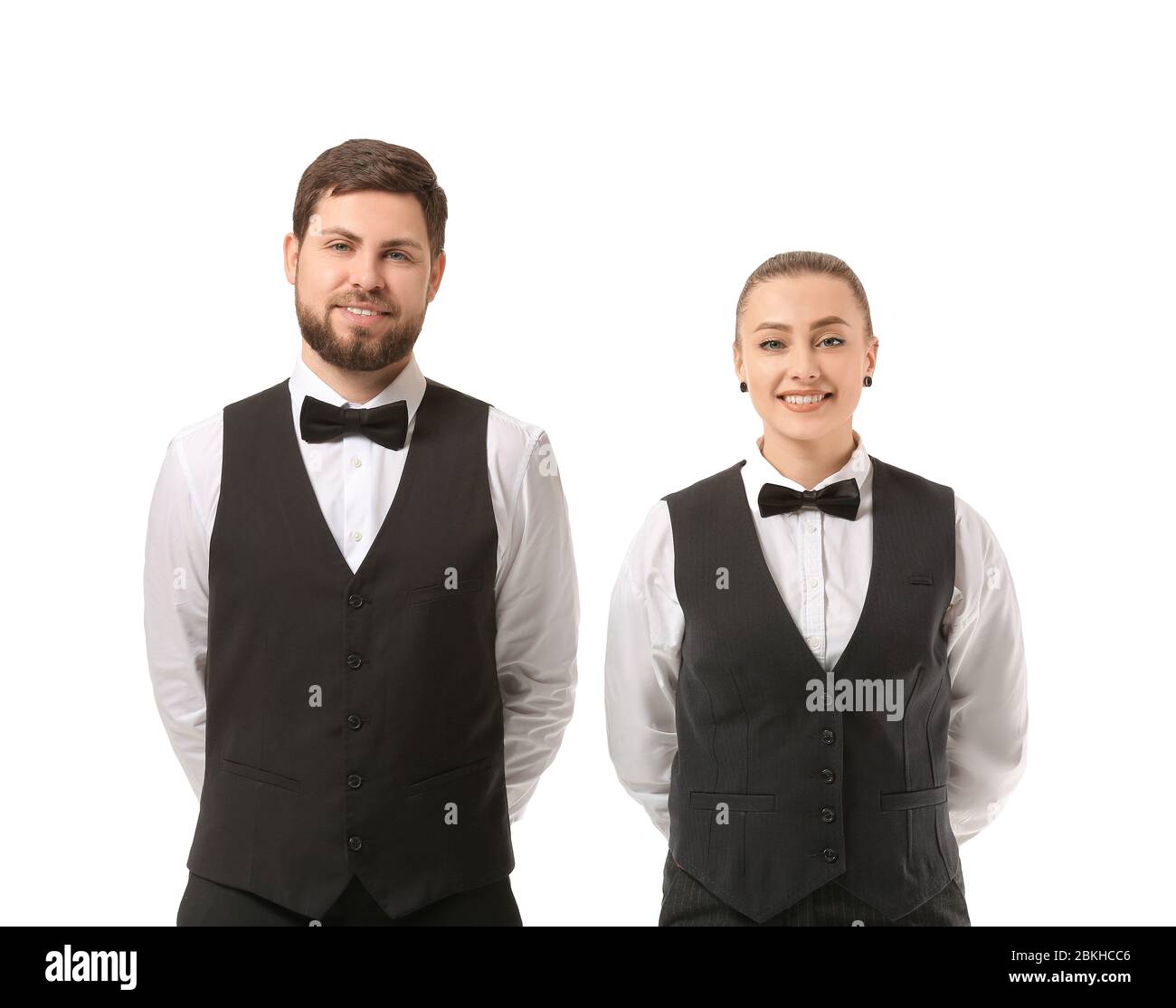 Male and female waiters on white background Stock Photo - Alamy