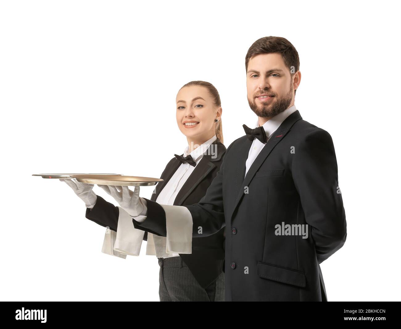 Male and female waiters on white background Stock Photo - Alamy