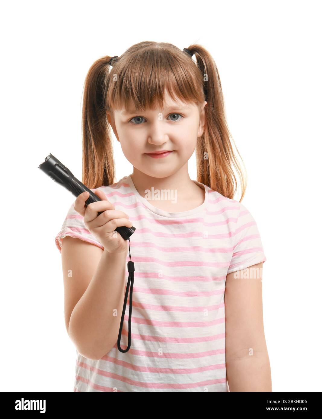 Little girl with flashlight on white background Stock Photo - Alamy