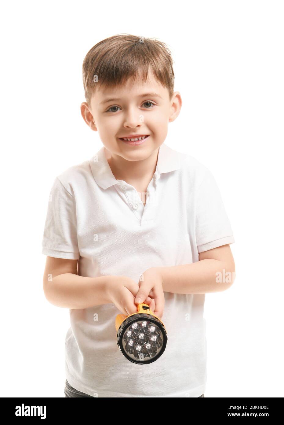 Little boy with flashlight on white background Stock Photo - Alamy