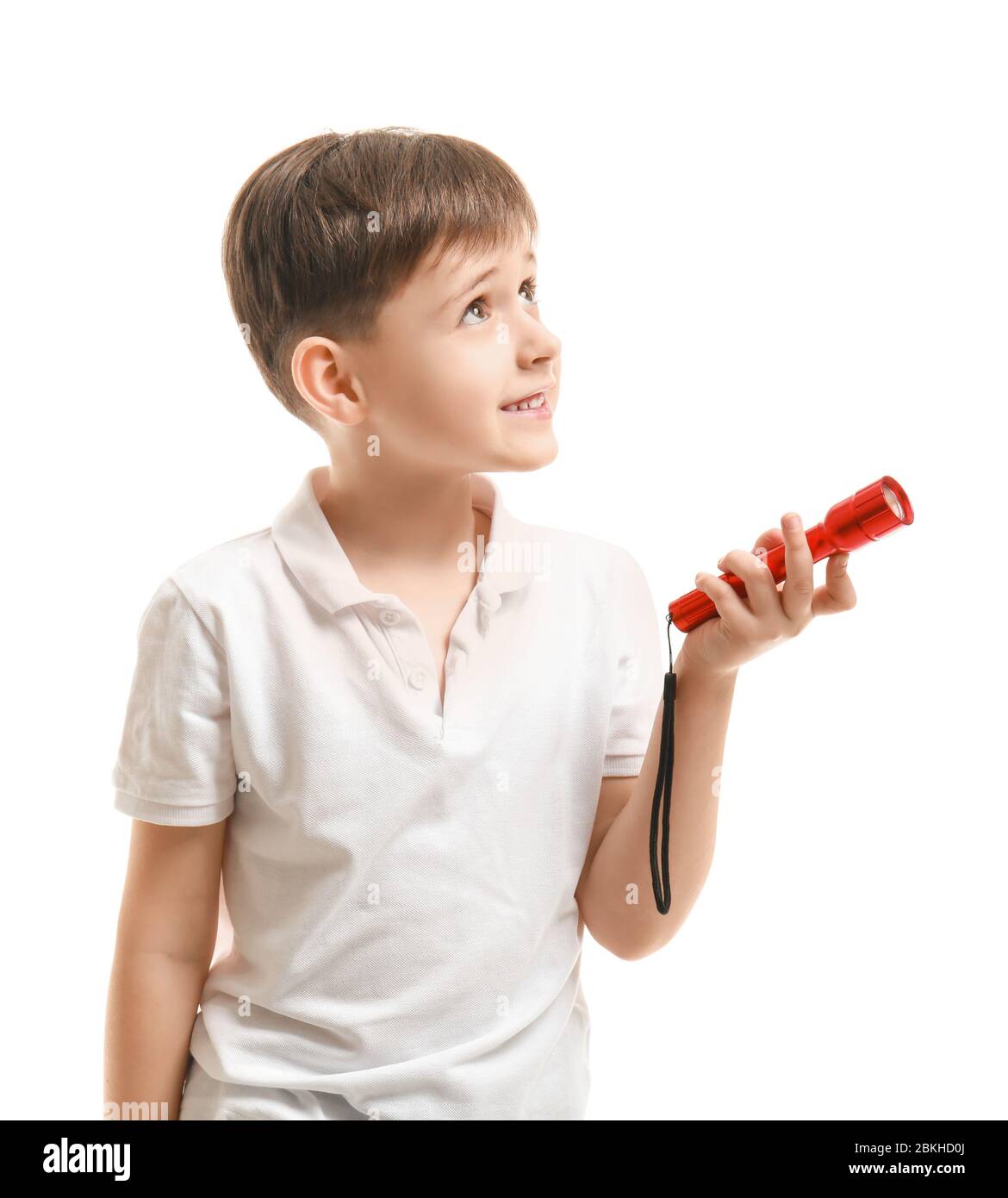 Little boy with flashlight on white background Stock Photo - Alamy