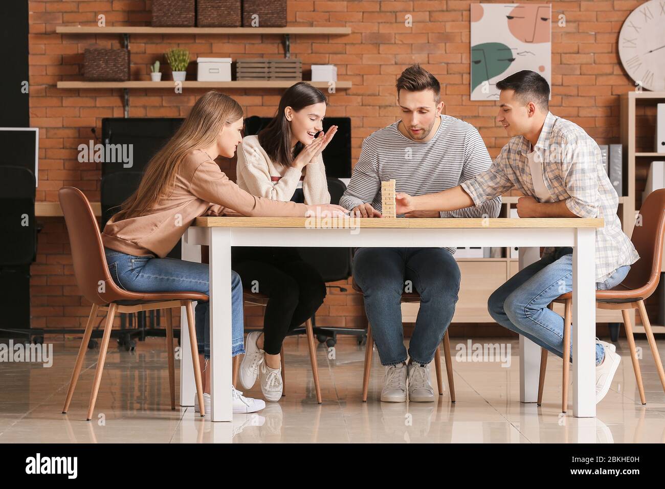 Team of business people playing jenga in office Stock Photo - Alamy