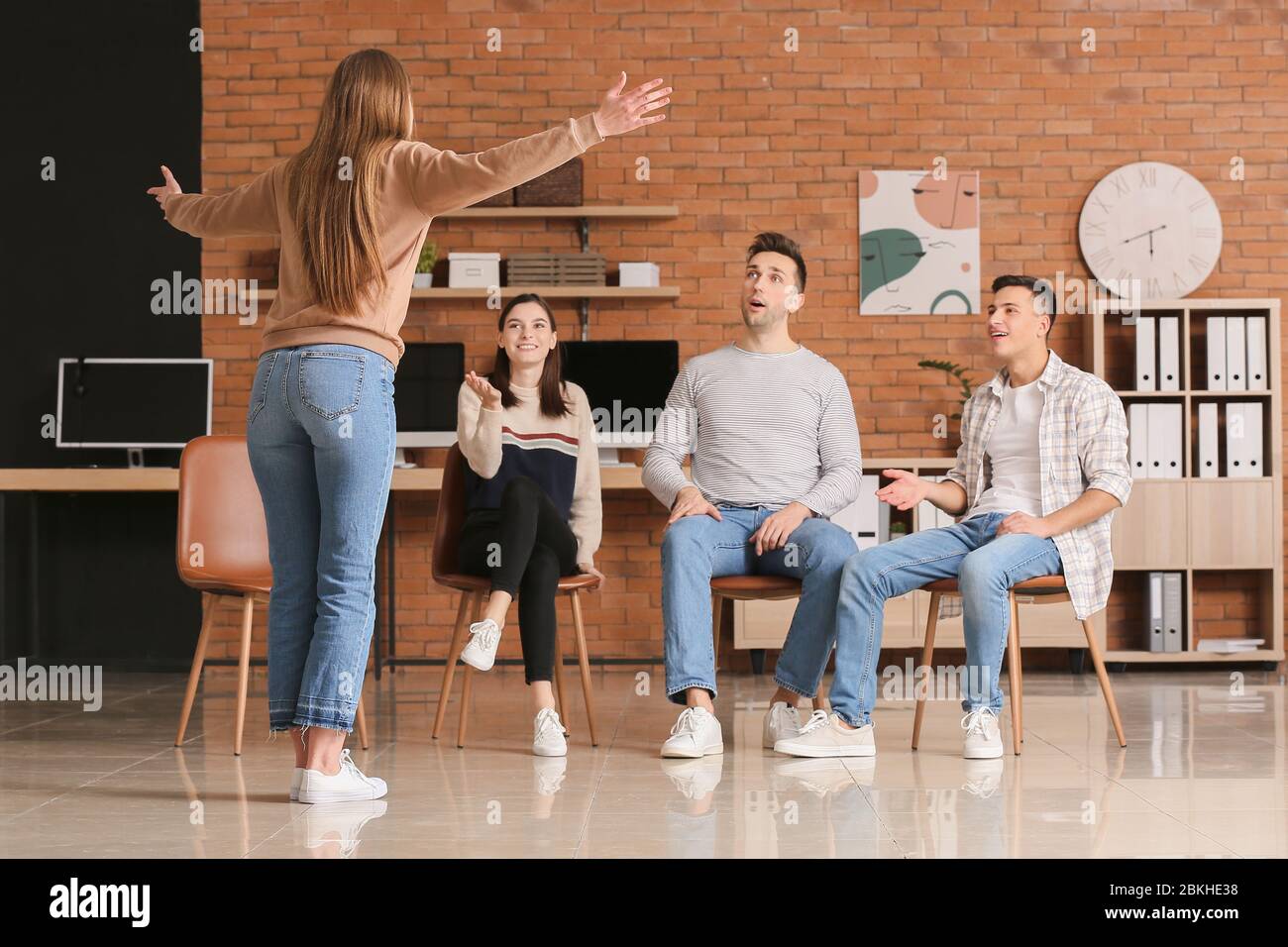Team of business people playing charades in office Stock Photo - Alamy