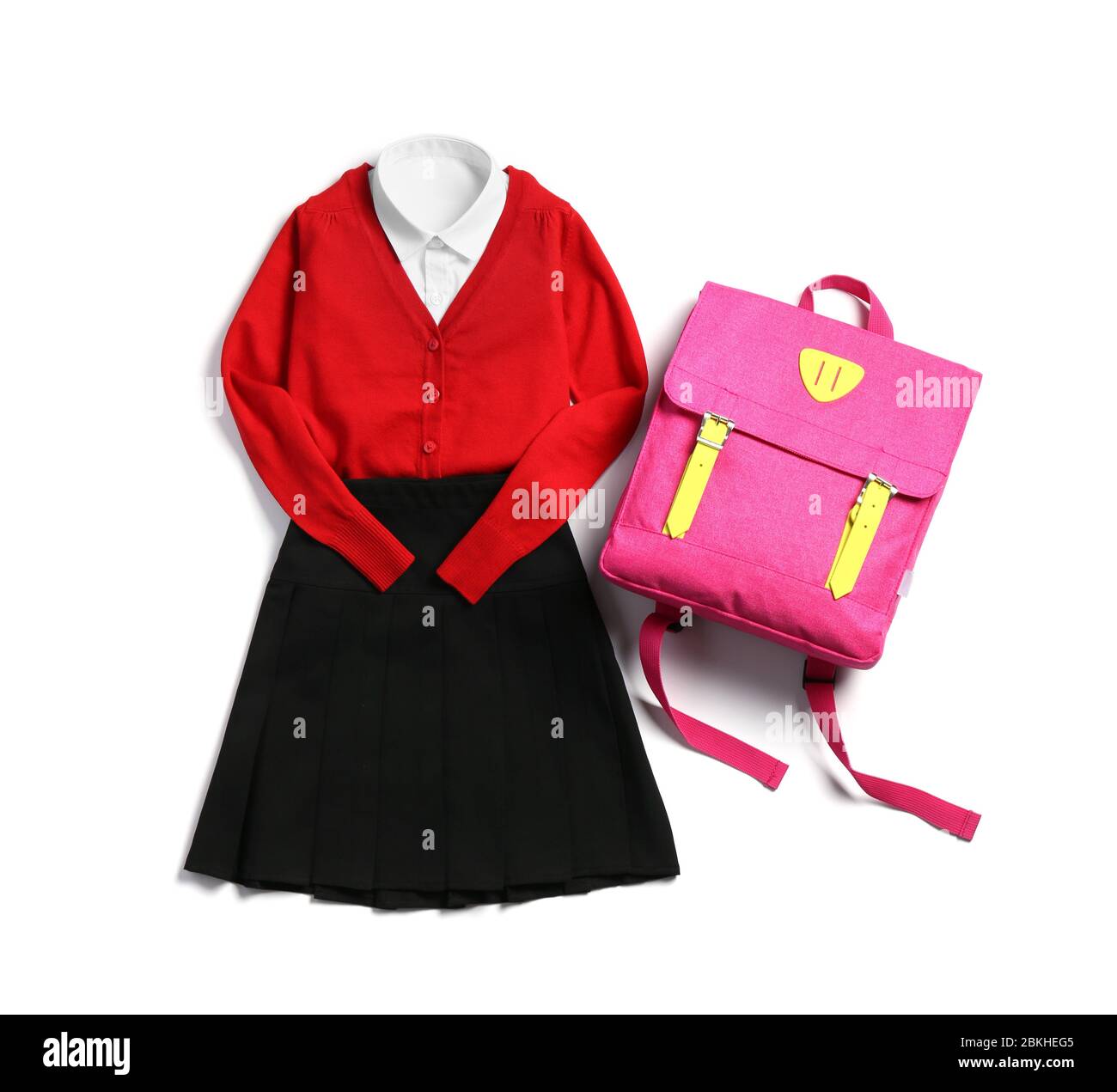Stylish school uniform with backpack on white background Stock Photo ...