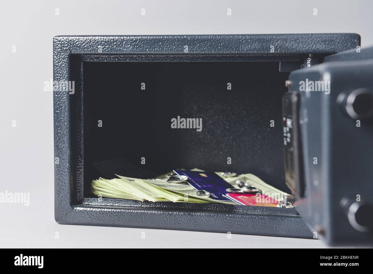Modern safe with valuables on light background Stock Photo - Alamy