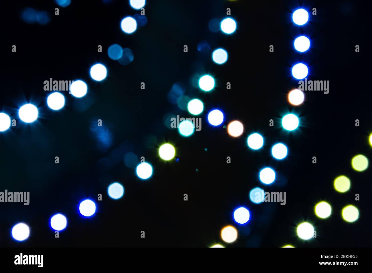 Colorful curved lines with lights of various colors with a Bokeh effect ...