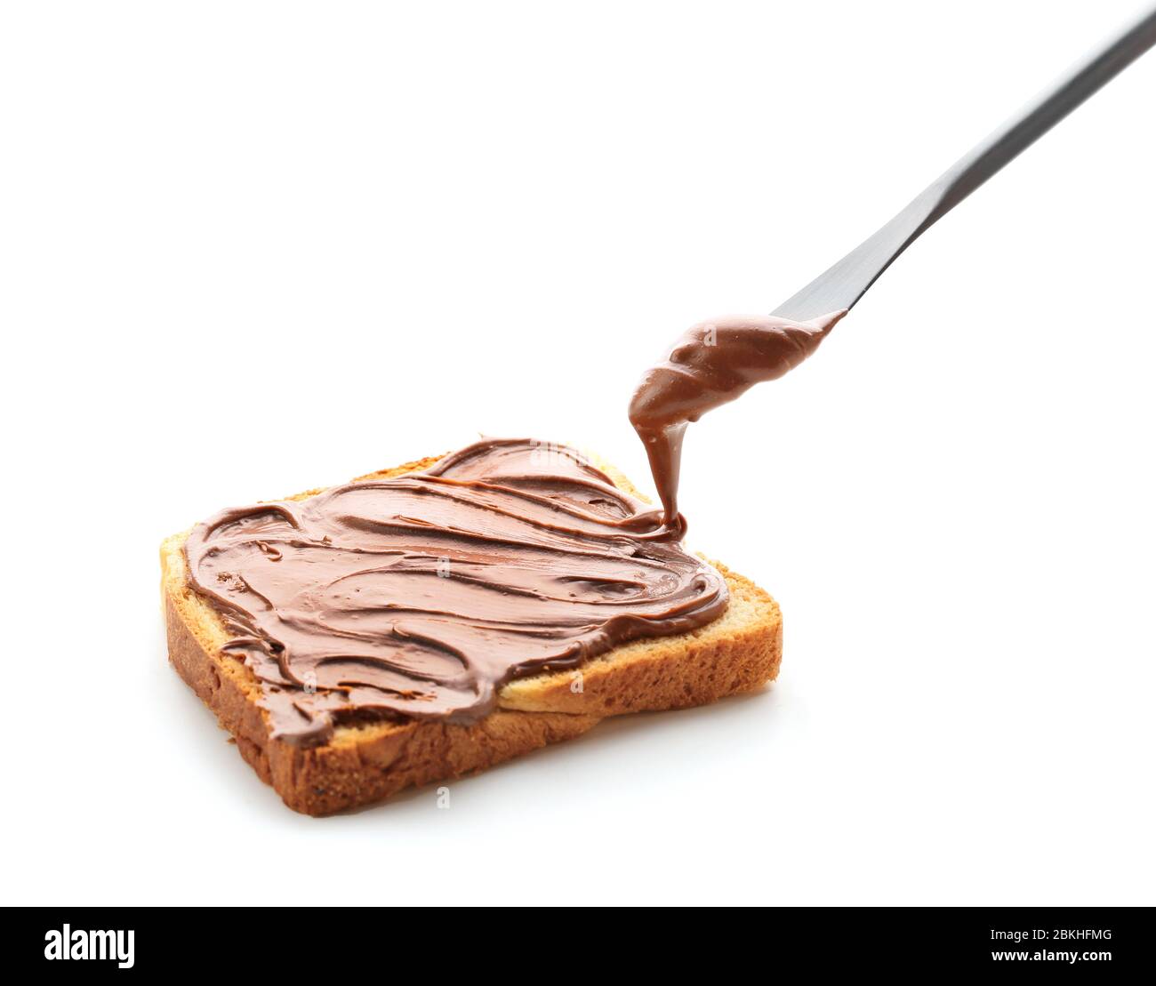 Fresh bread with tasty chocolate paste and knife on white background ...