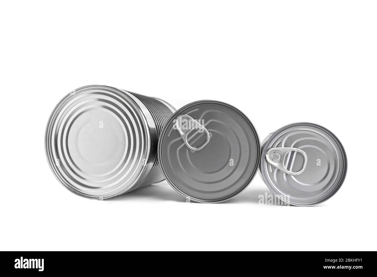 three tin cans isolated on white, food donation concept, front view ...