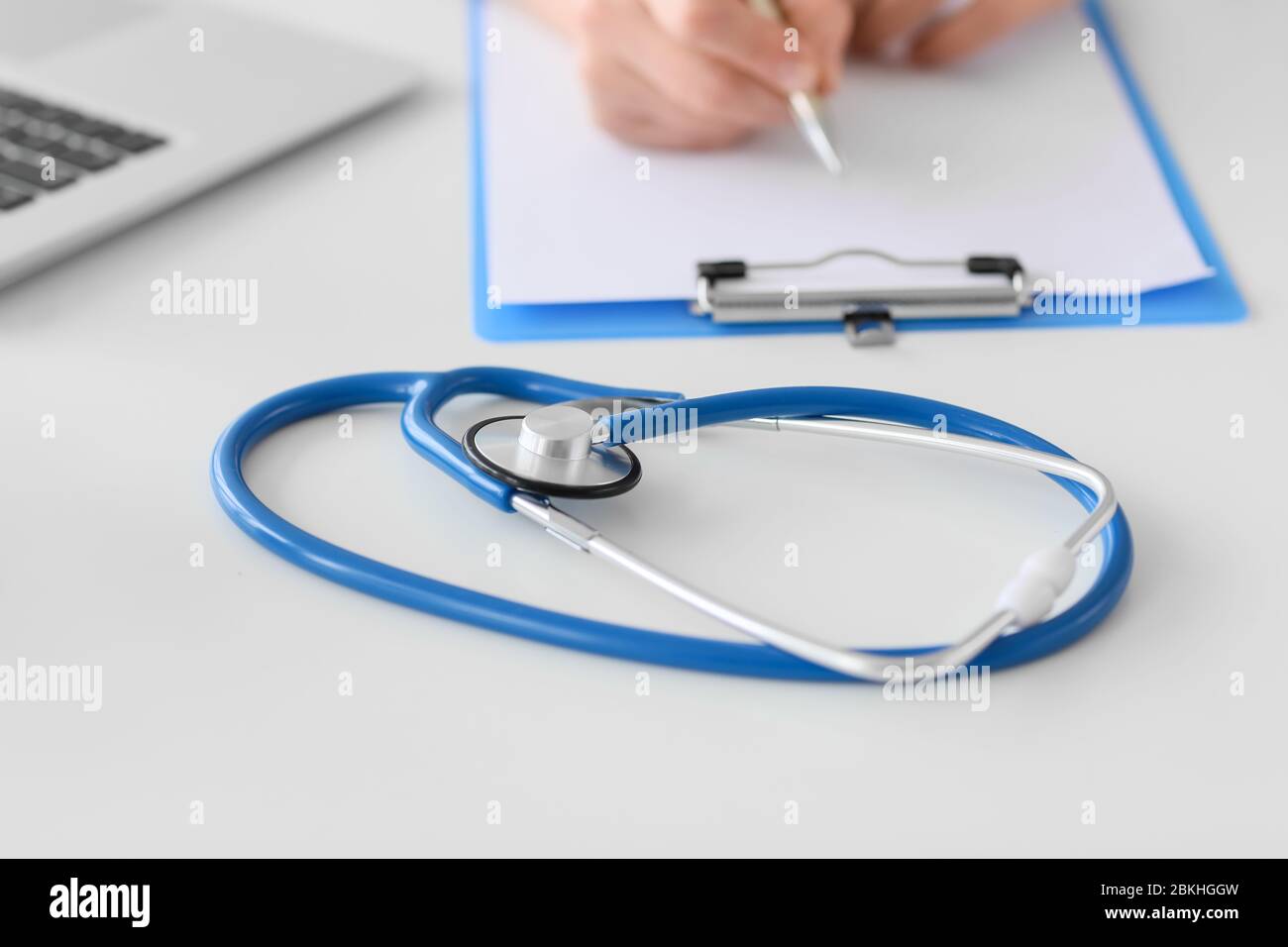 Stethoscope on doctor's table in clinic Stock Photo - Alamy