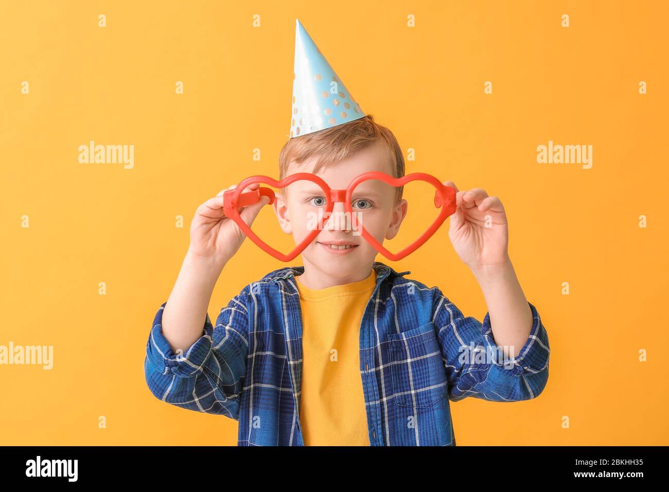 Cute little boy celebrating Birthday on color background Stock Photo ...