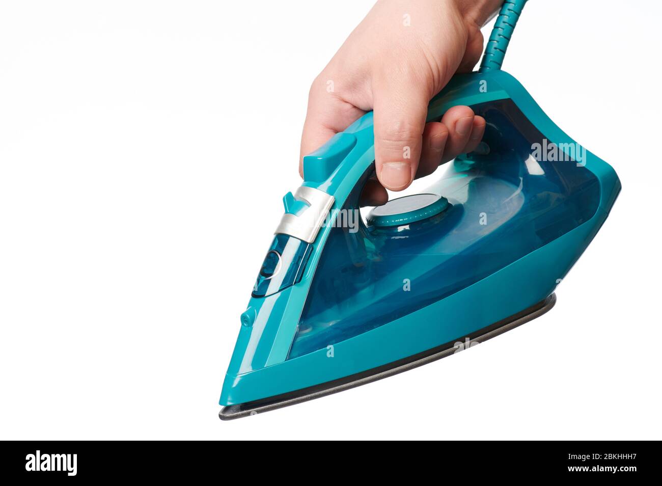 Hand holding modern colorful iron isolated on white studio background ...