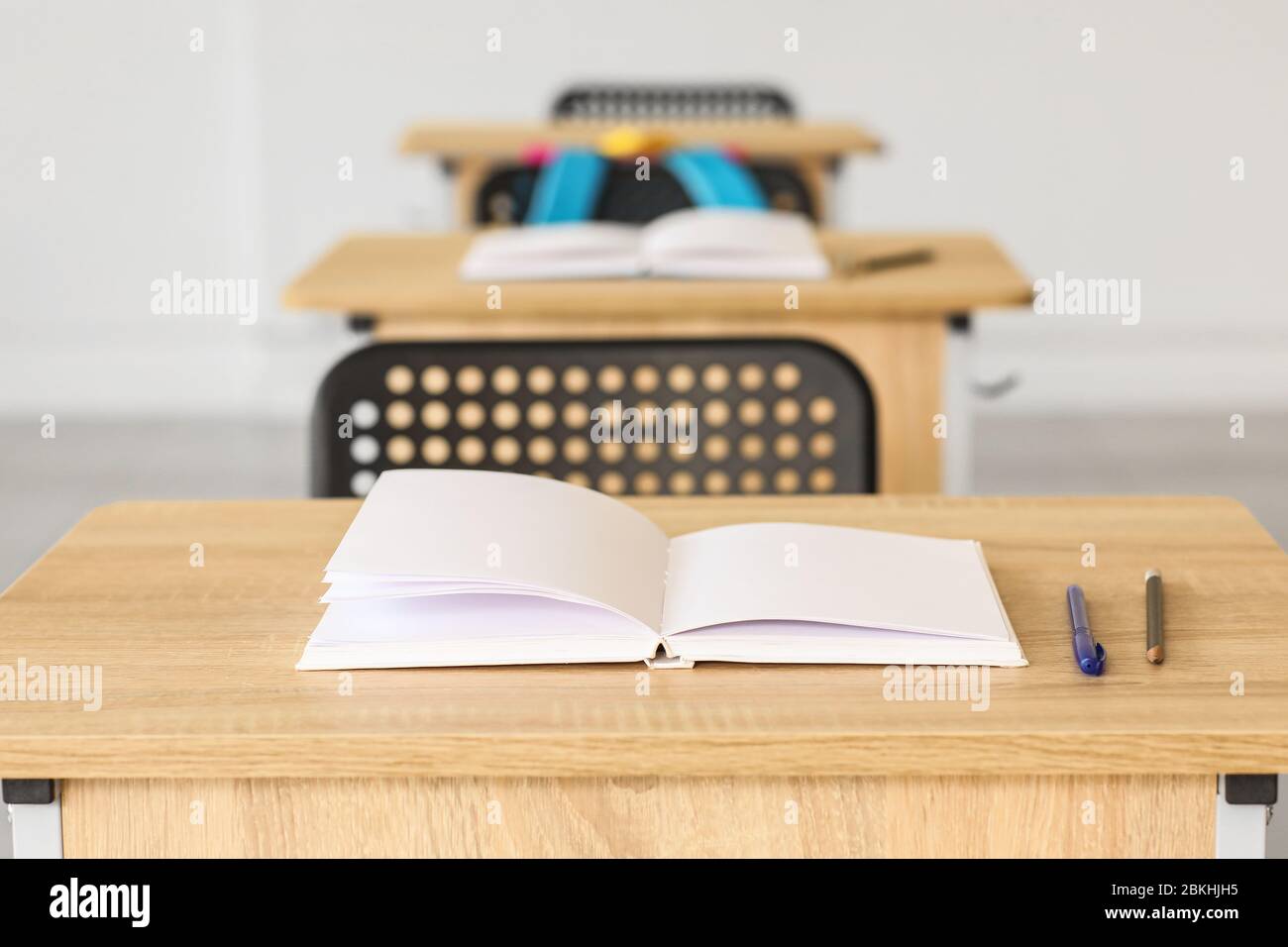 Modern desk in school classroom Stock Photo - Alamy