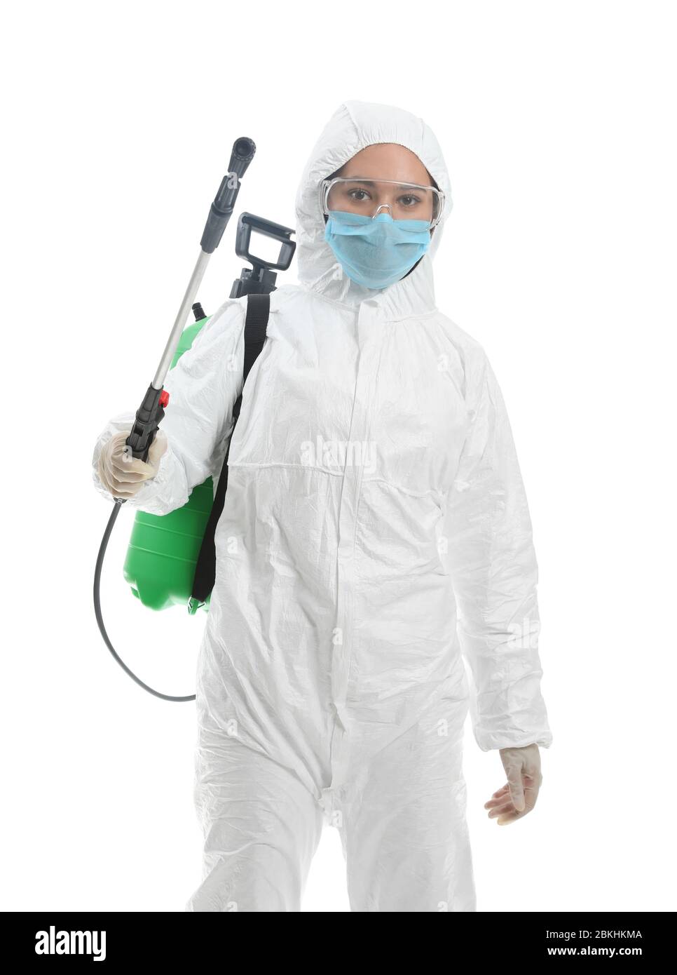 Worker in biohazard suit and with disinfectant on white background ...