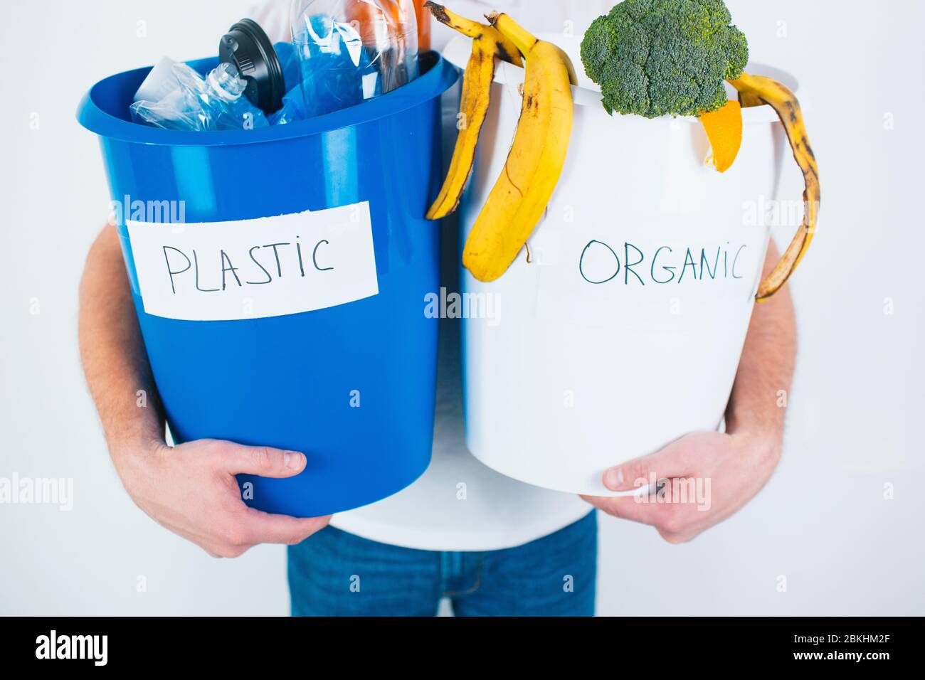Young man isolated over white background. Cut view of a guy holding ...