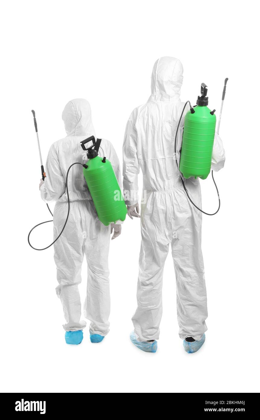 Workers in biohazard suits and with disinfectant on white background ...