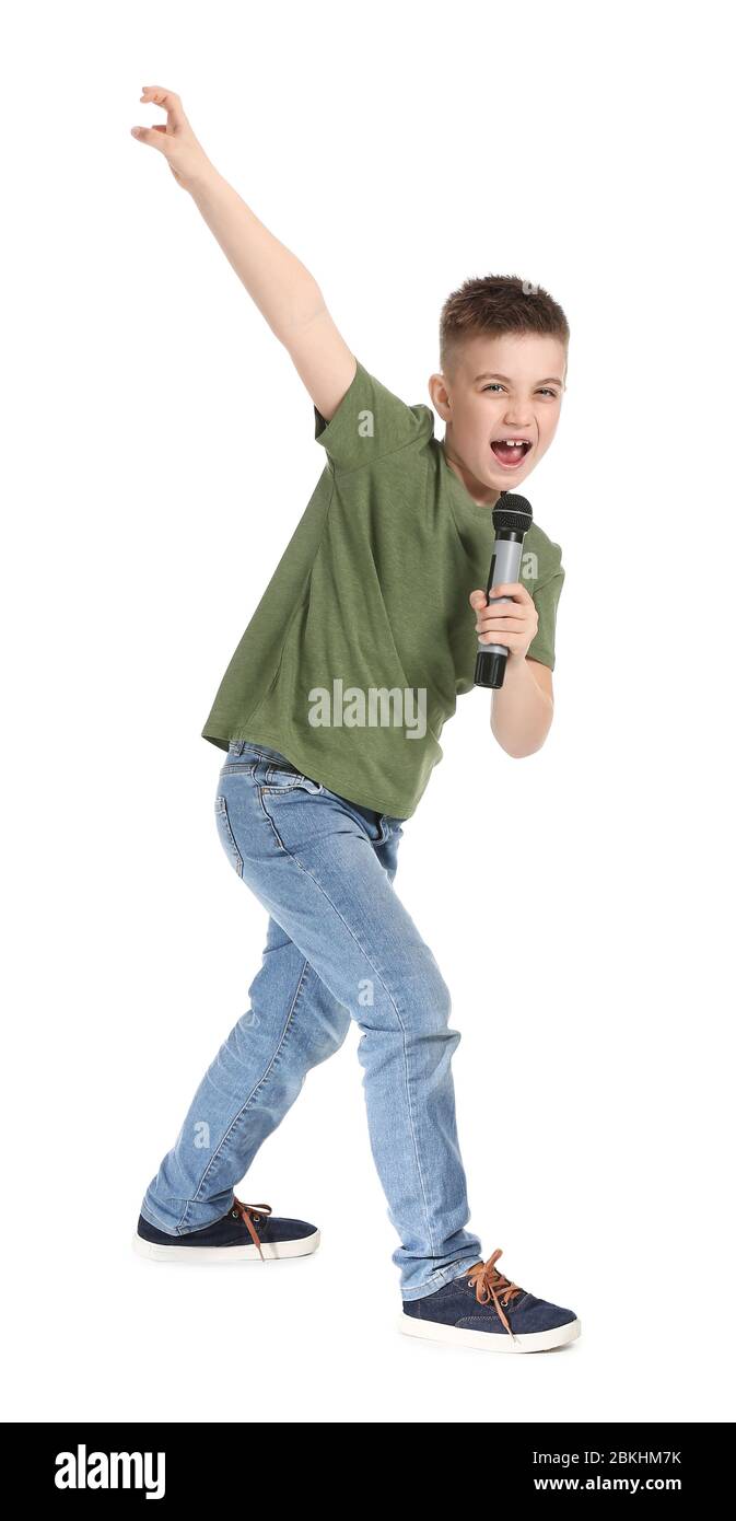 Cute little boy singing against white background Stock Photo - Alamy