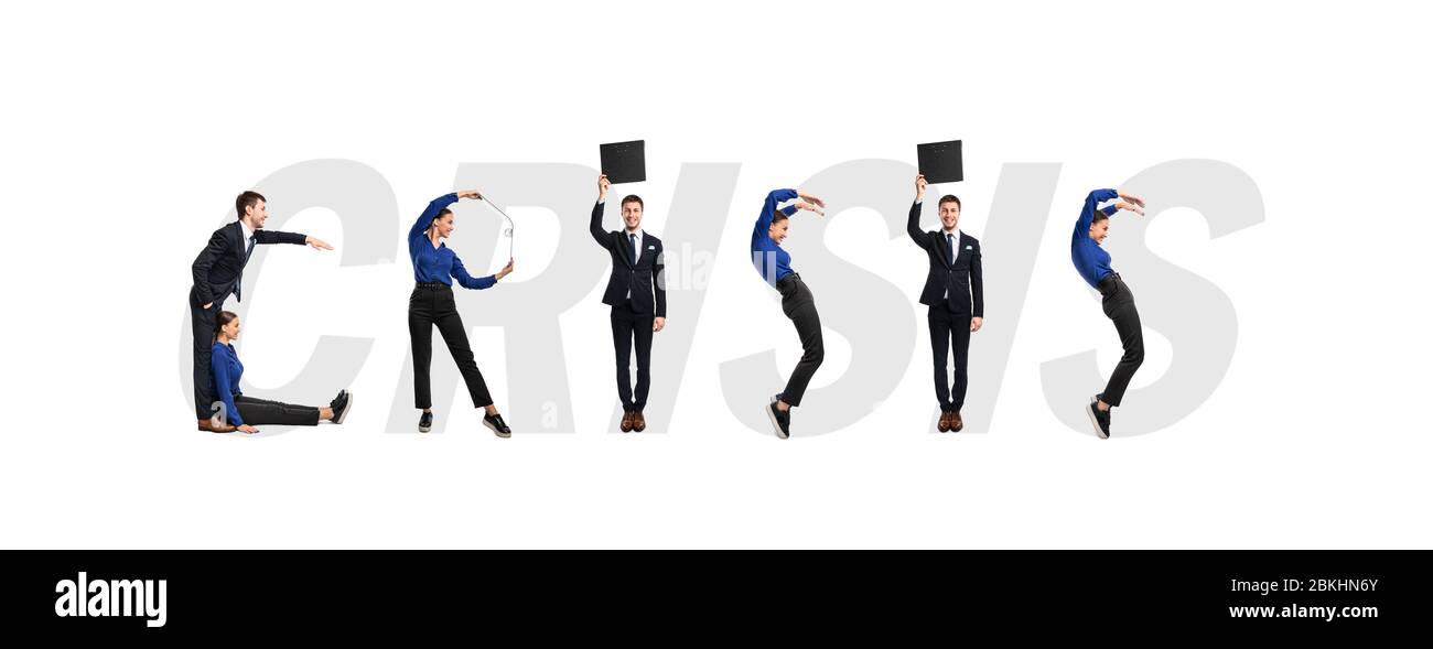 Group of people forming crisis word at studio Stock Photo - Alamy