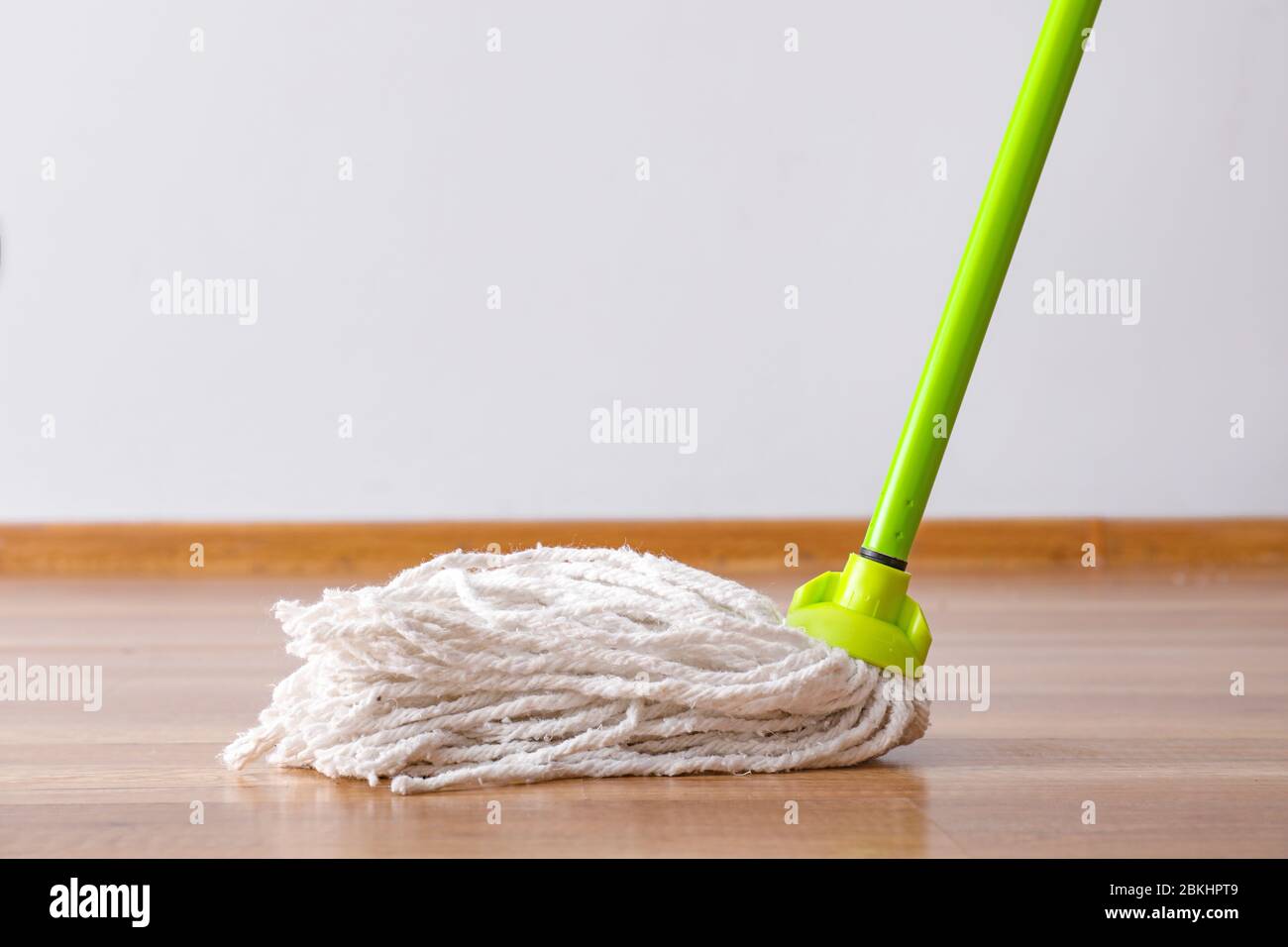 Cleaning of floor with mop Stock Photo - Alamy