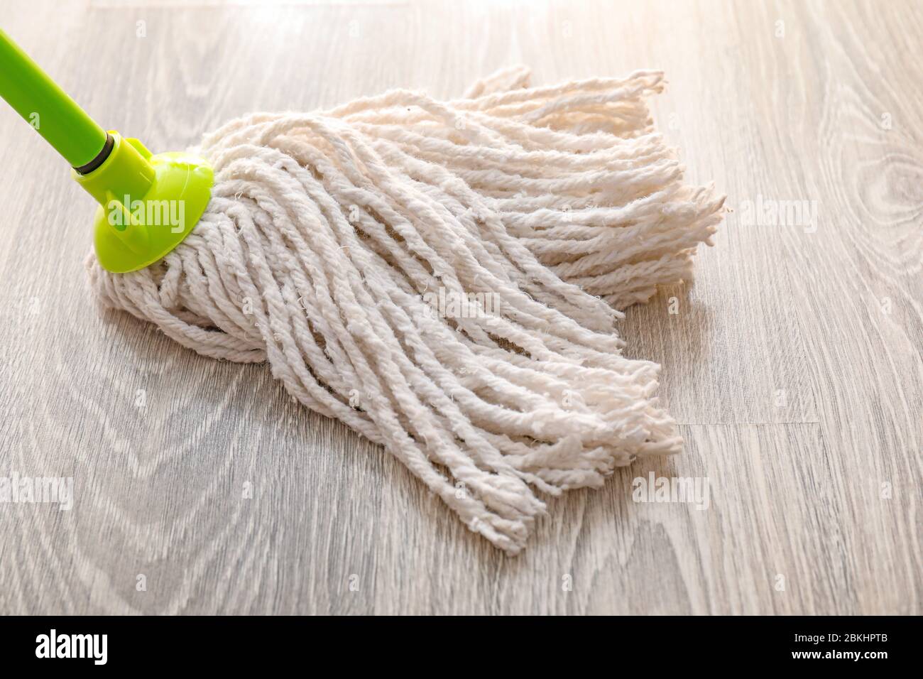 Cleaning of floor with mop Stock Photo - Alamy