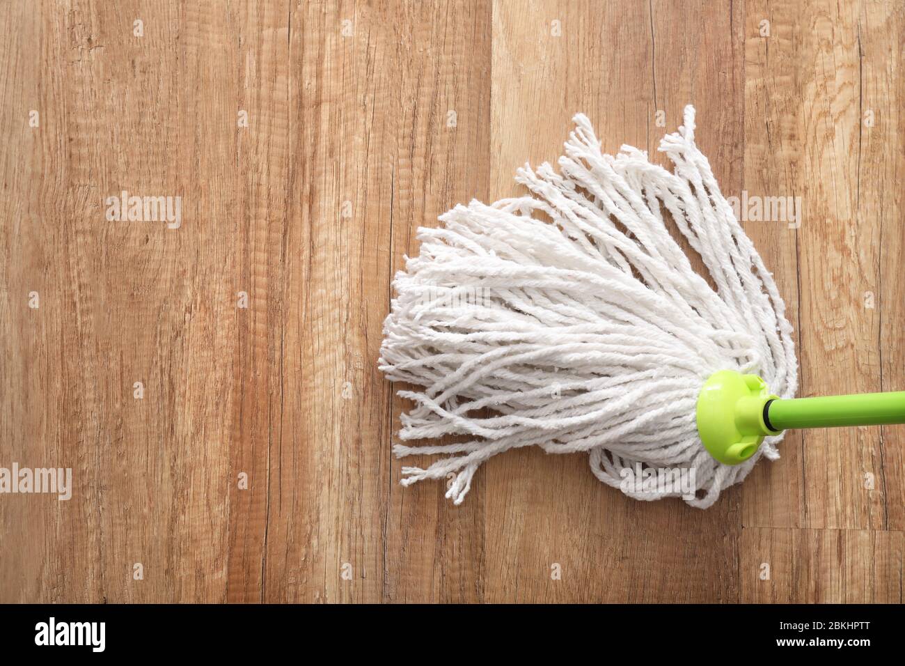 Cleaning of floor with mop Stock Photo - Alamy