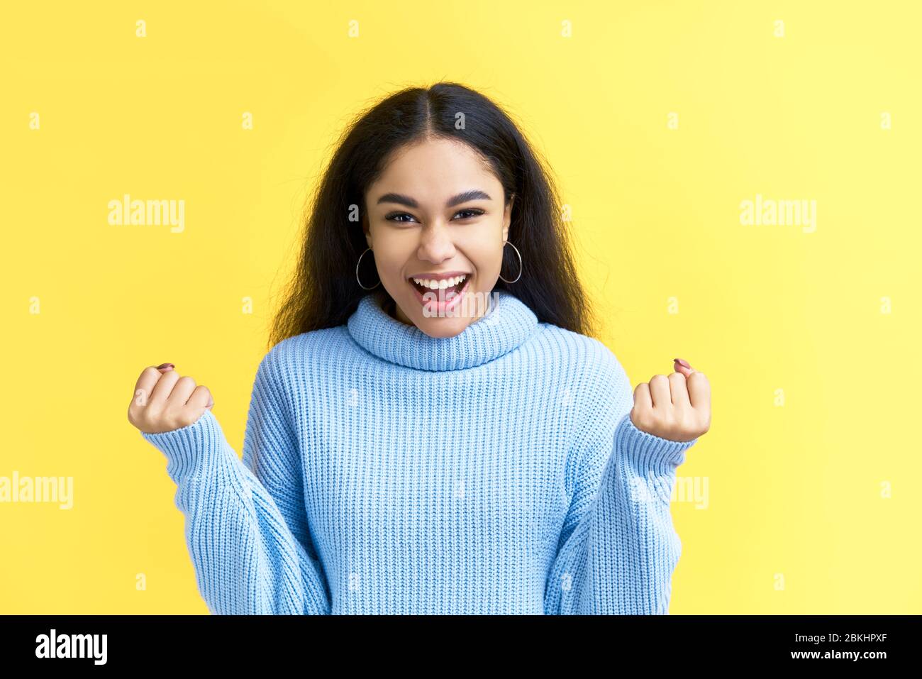Happy excited black woman celebrate success isolated on yellow ...