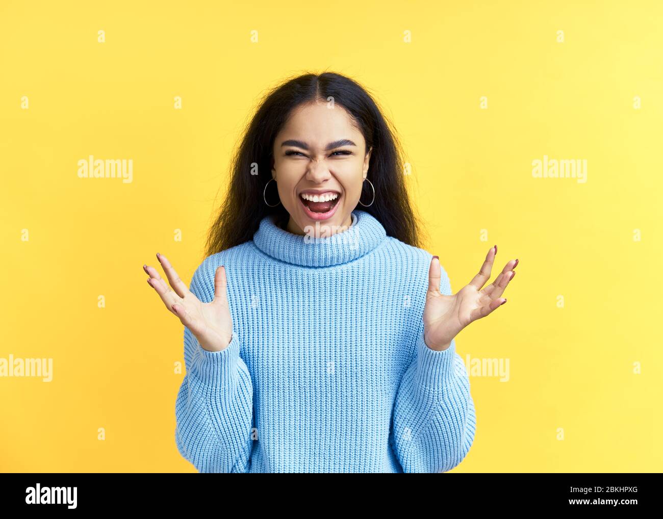 Happy excited black woman celebrate success isolated on yellow ...