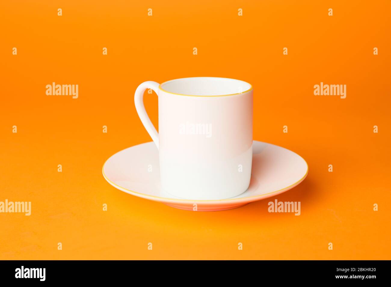 Blank cup on color background Stock Photo - Alamy
