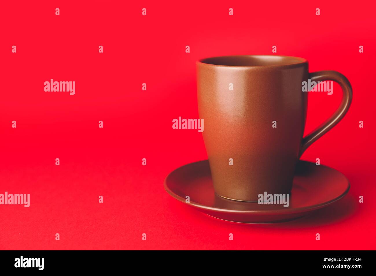 Blank cup on color background Stock Photo - Alamy