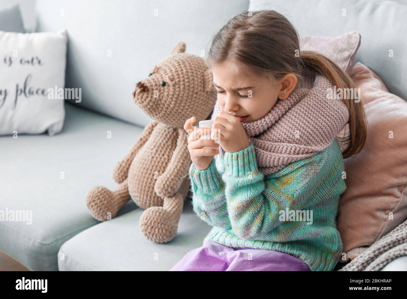 Sick little girl with medicine at home Stock Photo - Alamy