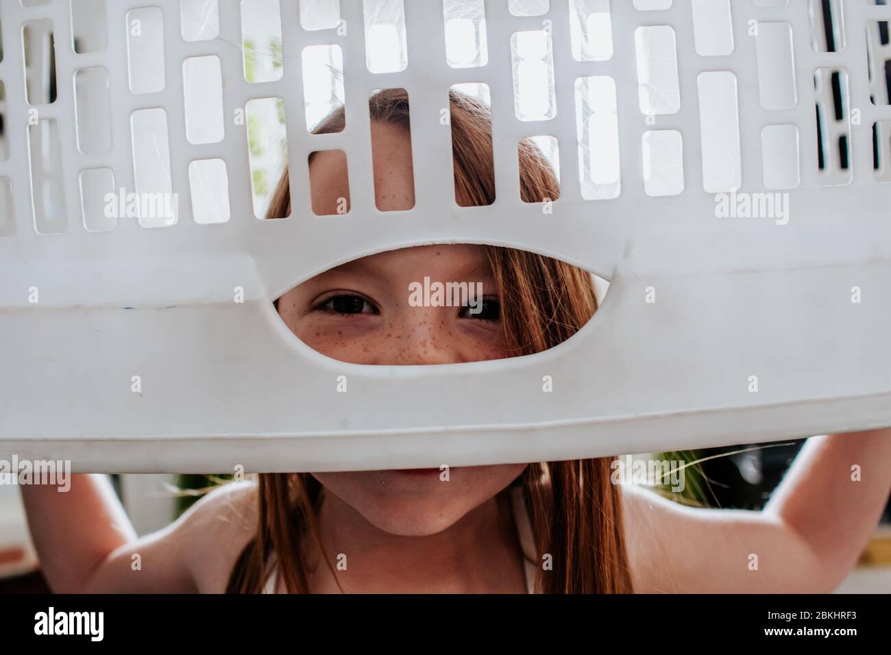 goofy cute child peeking through laundry basket Stock Photo - Alamy goofy cute child peeking through laundry basket Stock Photo - Alamy