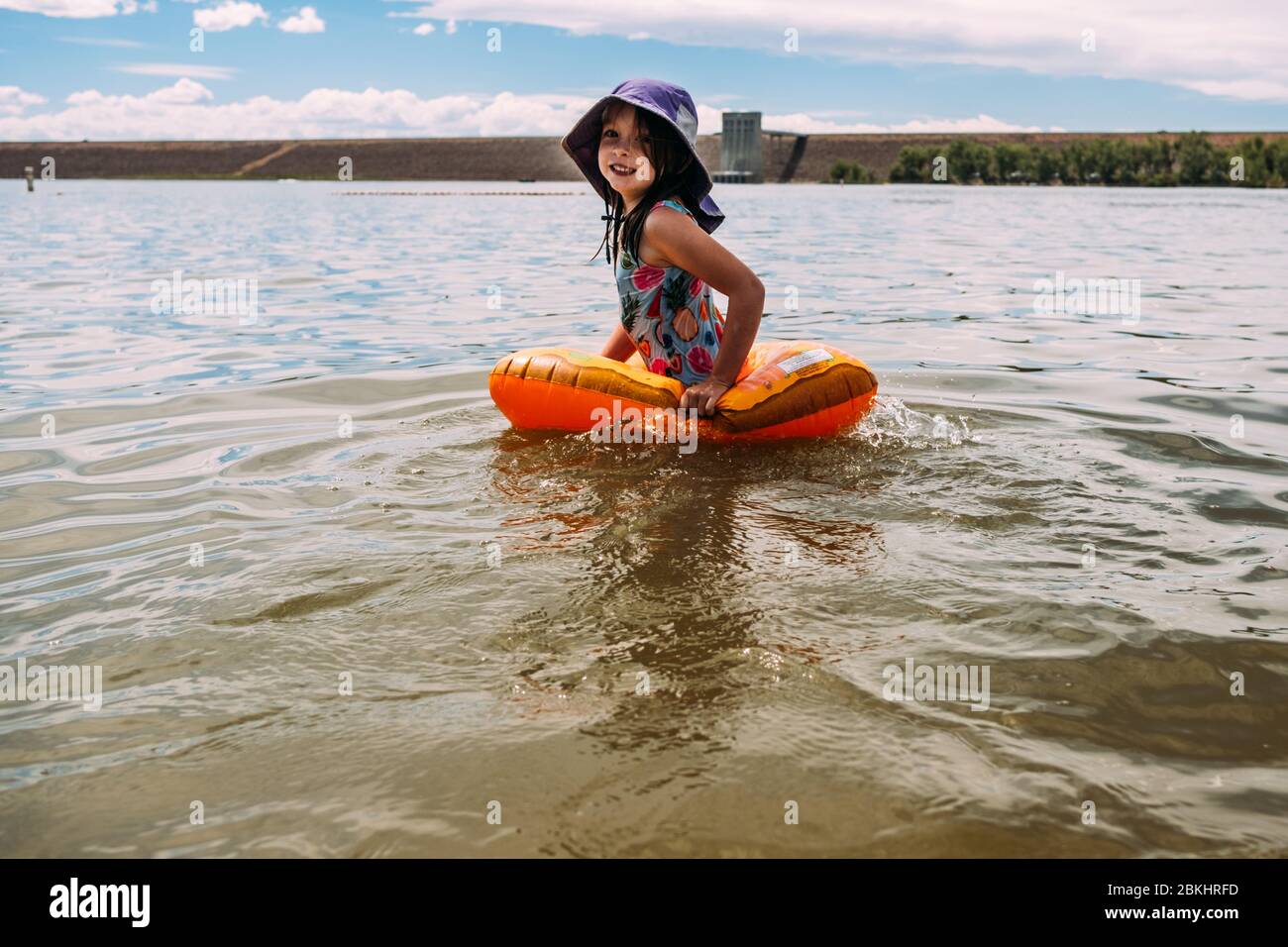 Happy kids swimming in lake hi-res stock photography and images - Alamy