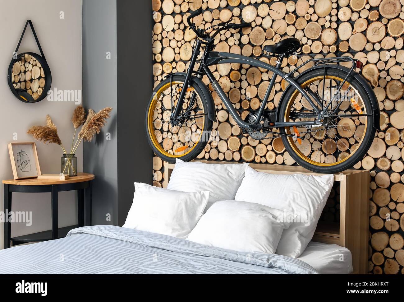 Interior of modern bedroom with bicycle Stock Photo - Alamy