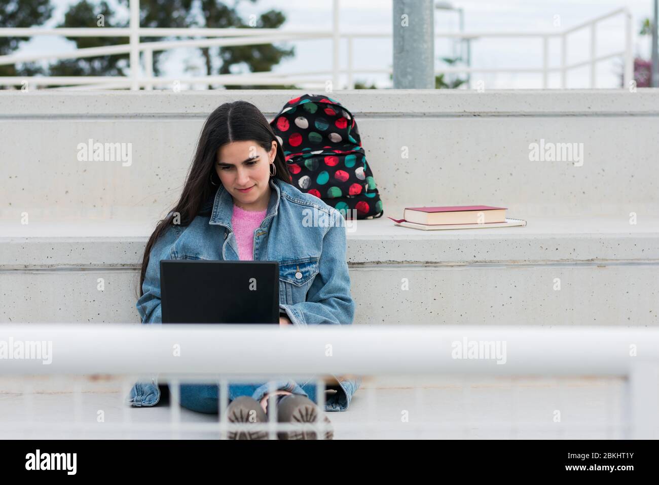 High school student typing at laptop hi-res stock photography and ...