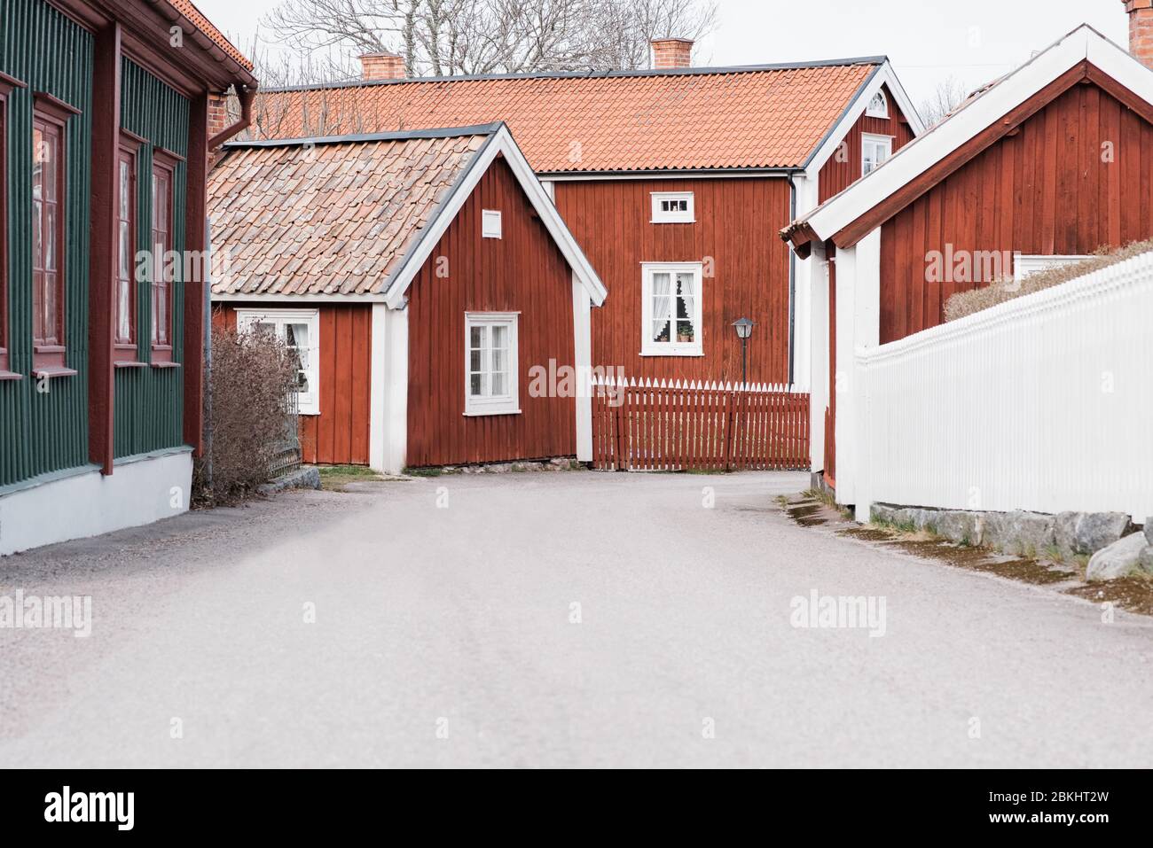 traditional Swedish street with red houses in Sweden Stock Photo - Alamy