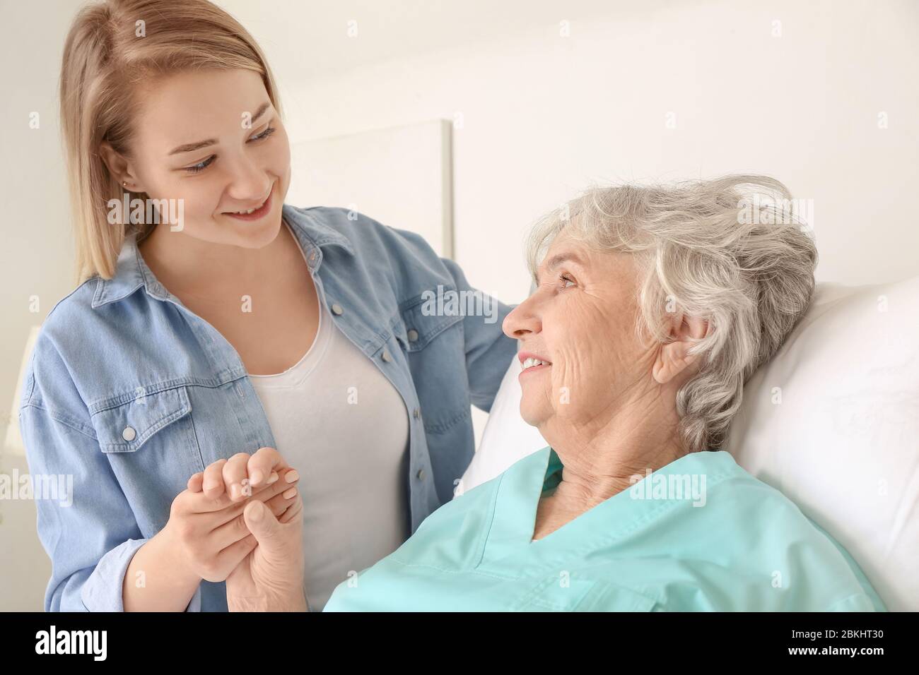 Young woman visiting her grandmother in hospital Stock Photo - Alamy